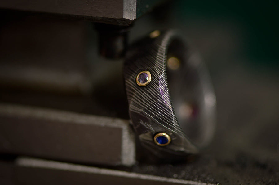 Infinity Ring, Gold, Dark Damascus Steel, & Gemstones – Stone Forge Studios